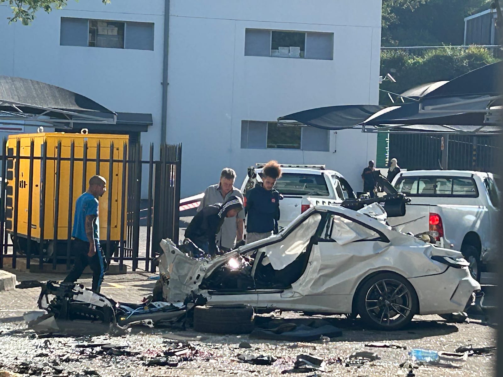 Four die after vehicle crashes into the roof of a car dealership ...