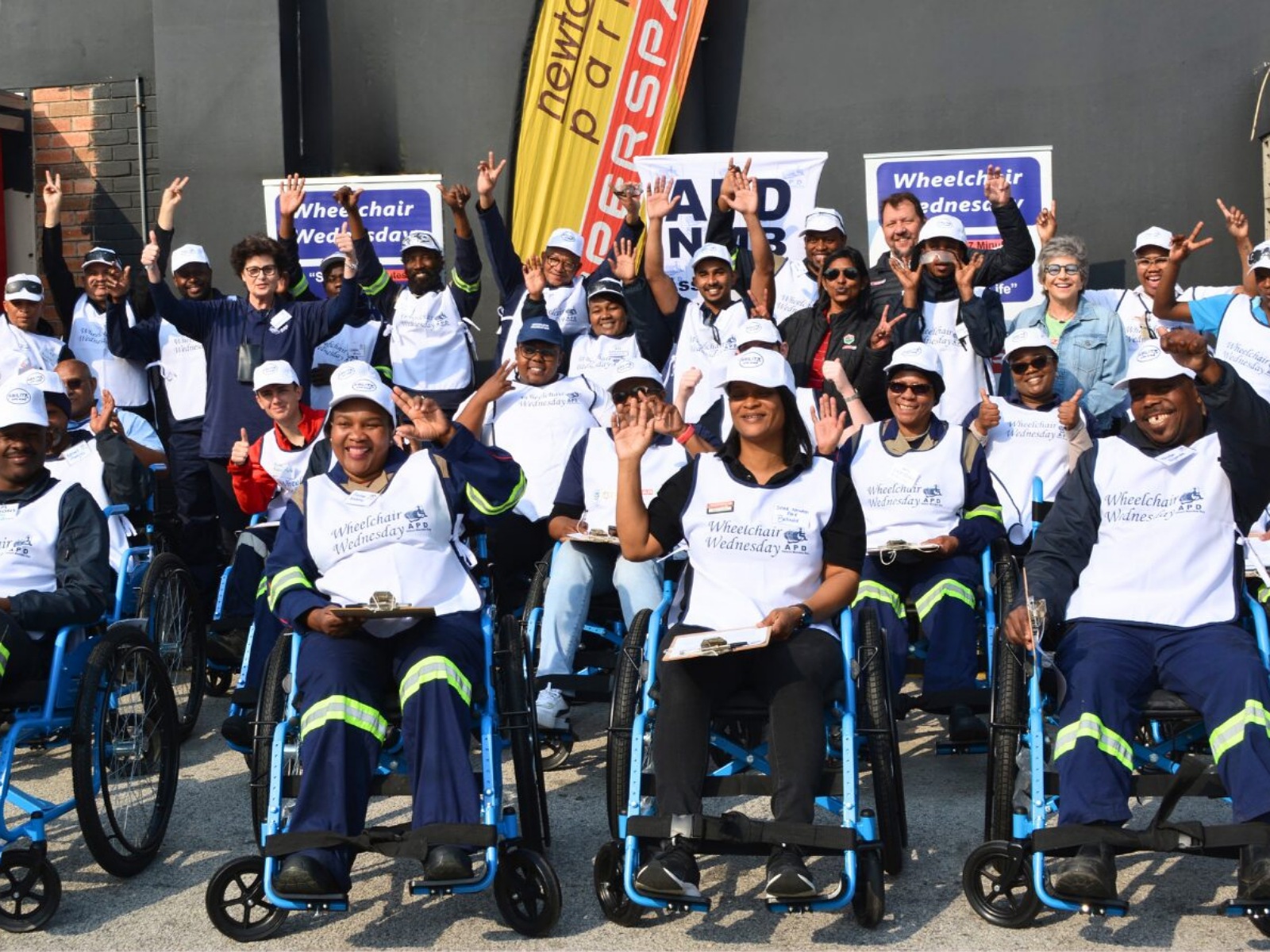Workers spend day in wheelchairs to understand disability struggles ...